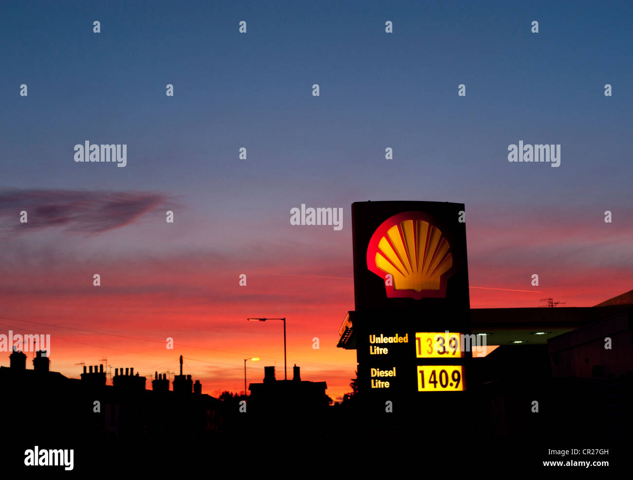 Shell garage sign against a red sky at night, Stratford-upon-Avon ...
