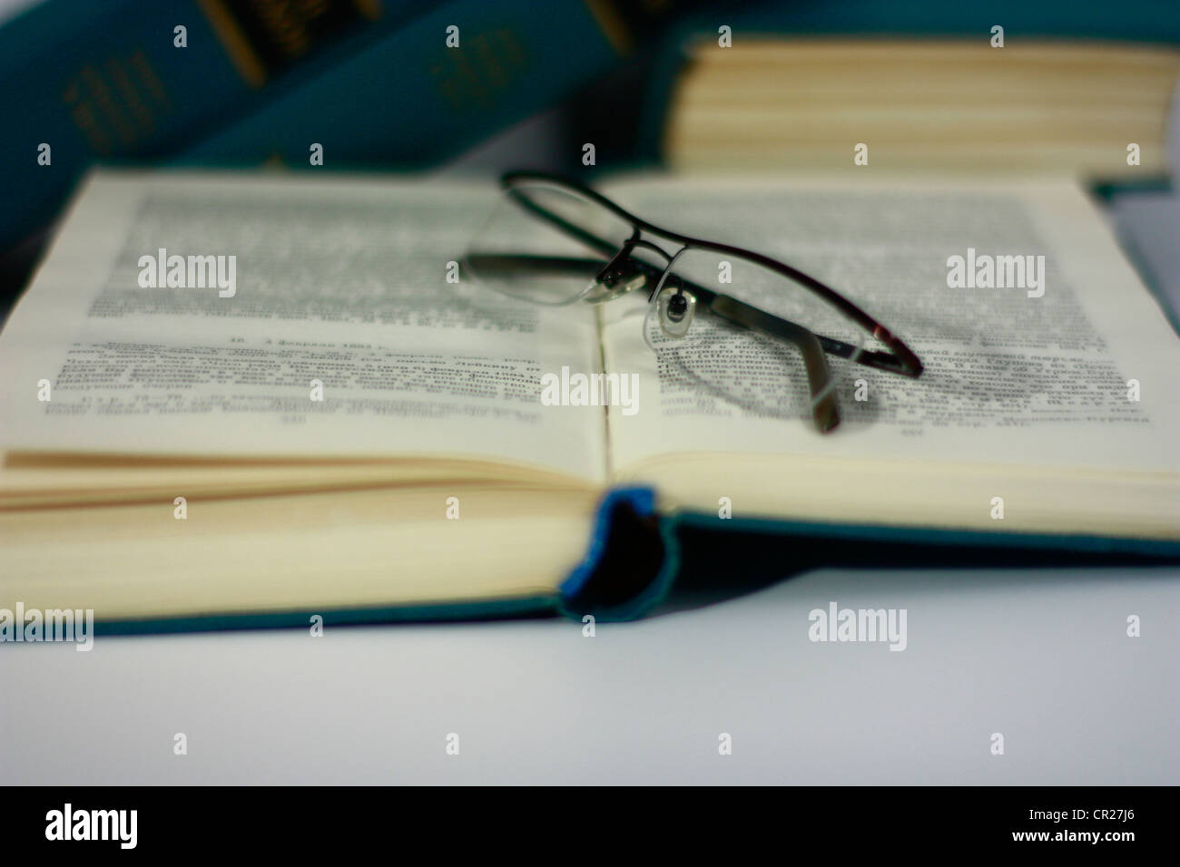 Eyeglasses on books Stock Photo - Alamy
