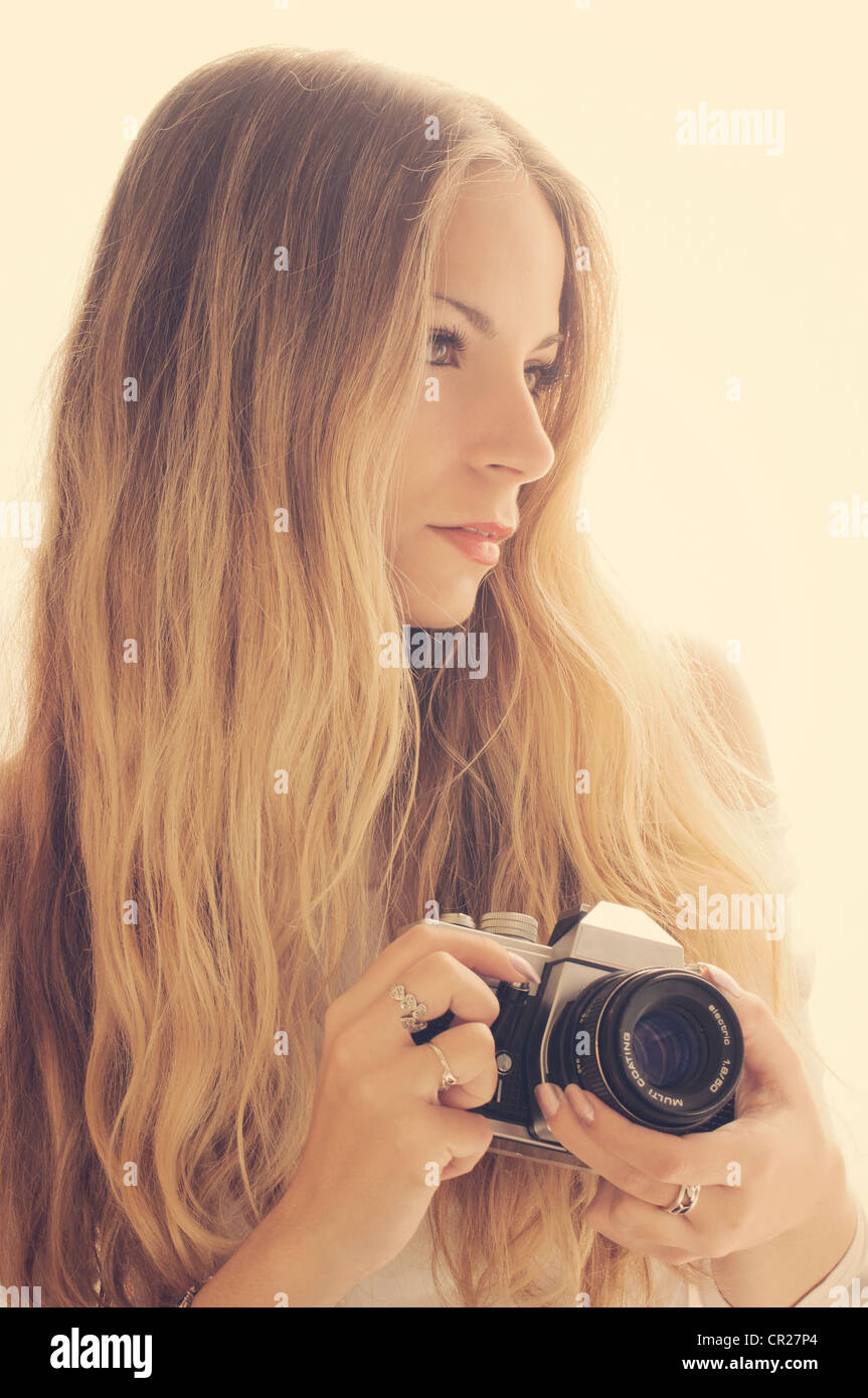 Girl with a camera Stock Photo - Alamy