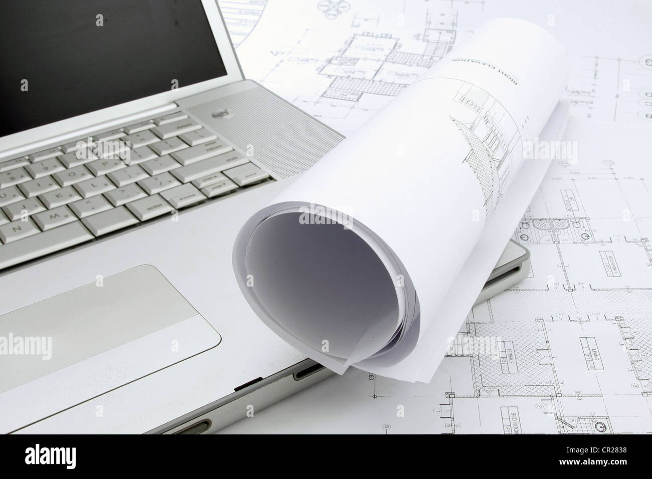 plans and laptop image Stock Photo - Alamy