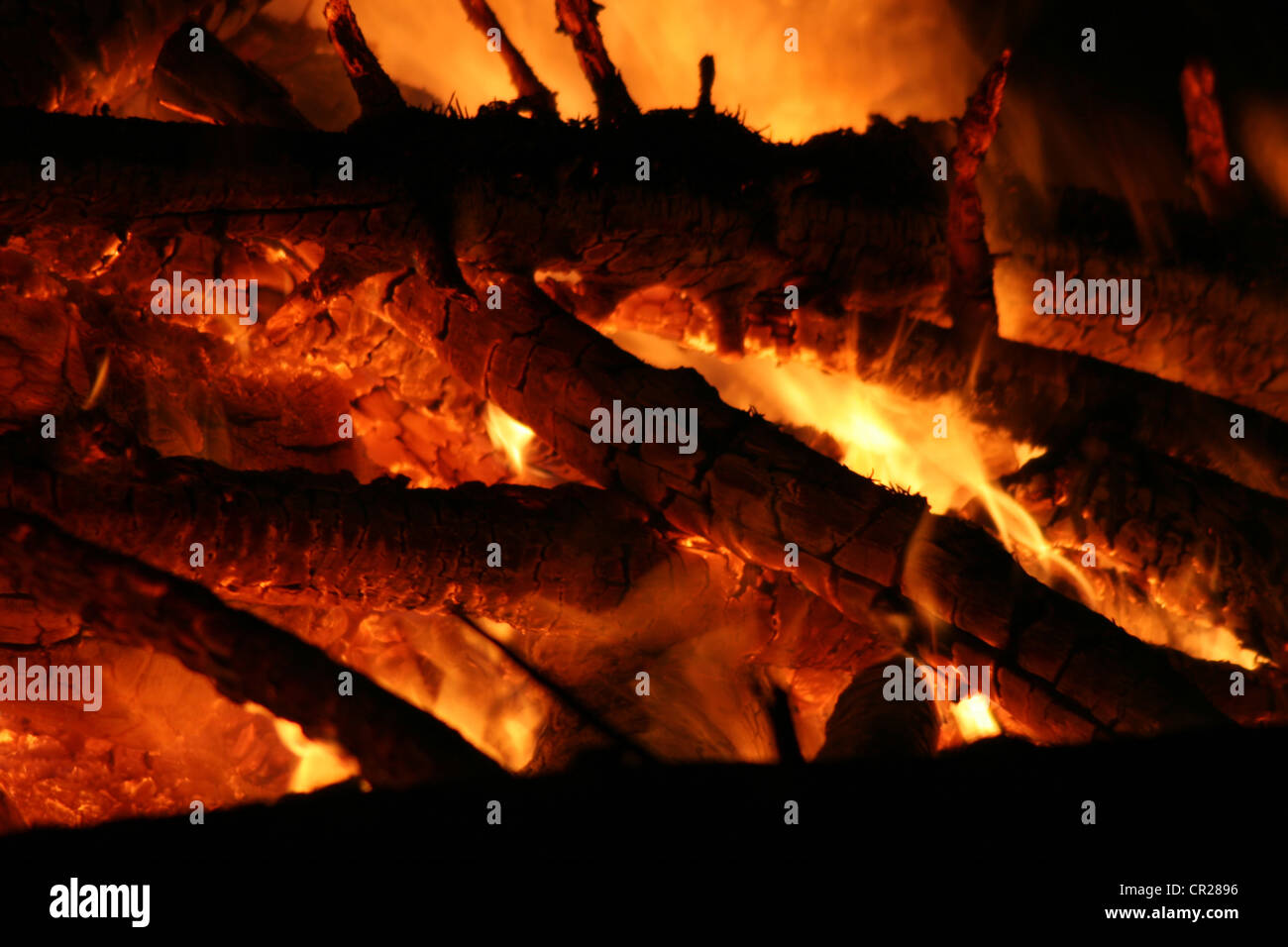 Fire with flickering flames of wood logs Stock Photo - Alamy