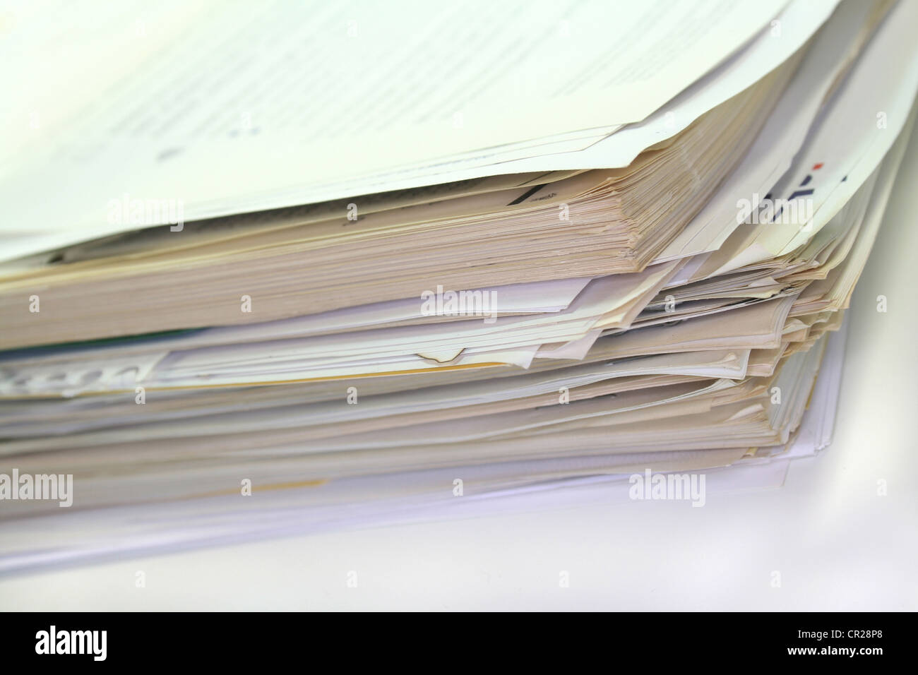 large stack of papers on a white background Stock Photo - Alamy