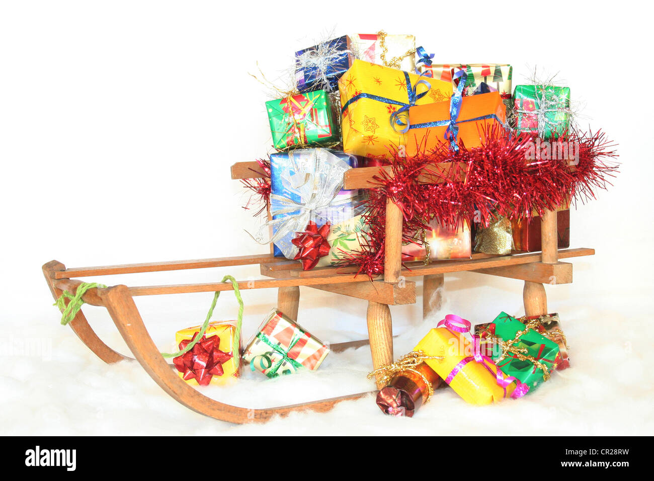 Sled in the snow with Christmas gifts on a white background Stock Photo ...