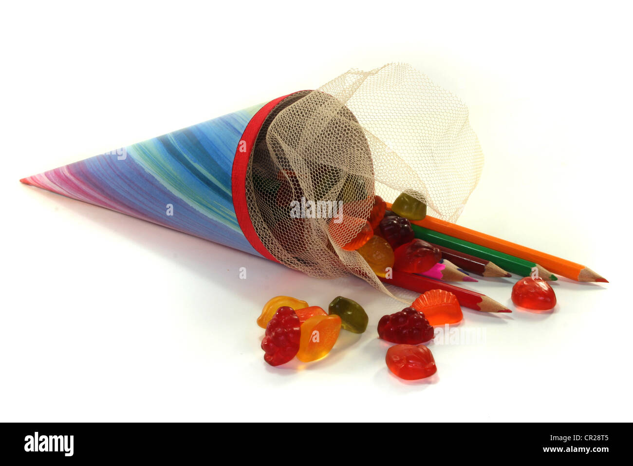 a colorful school cone filled with candy on a white background Stock ...