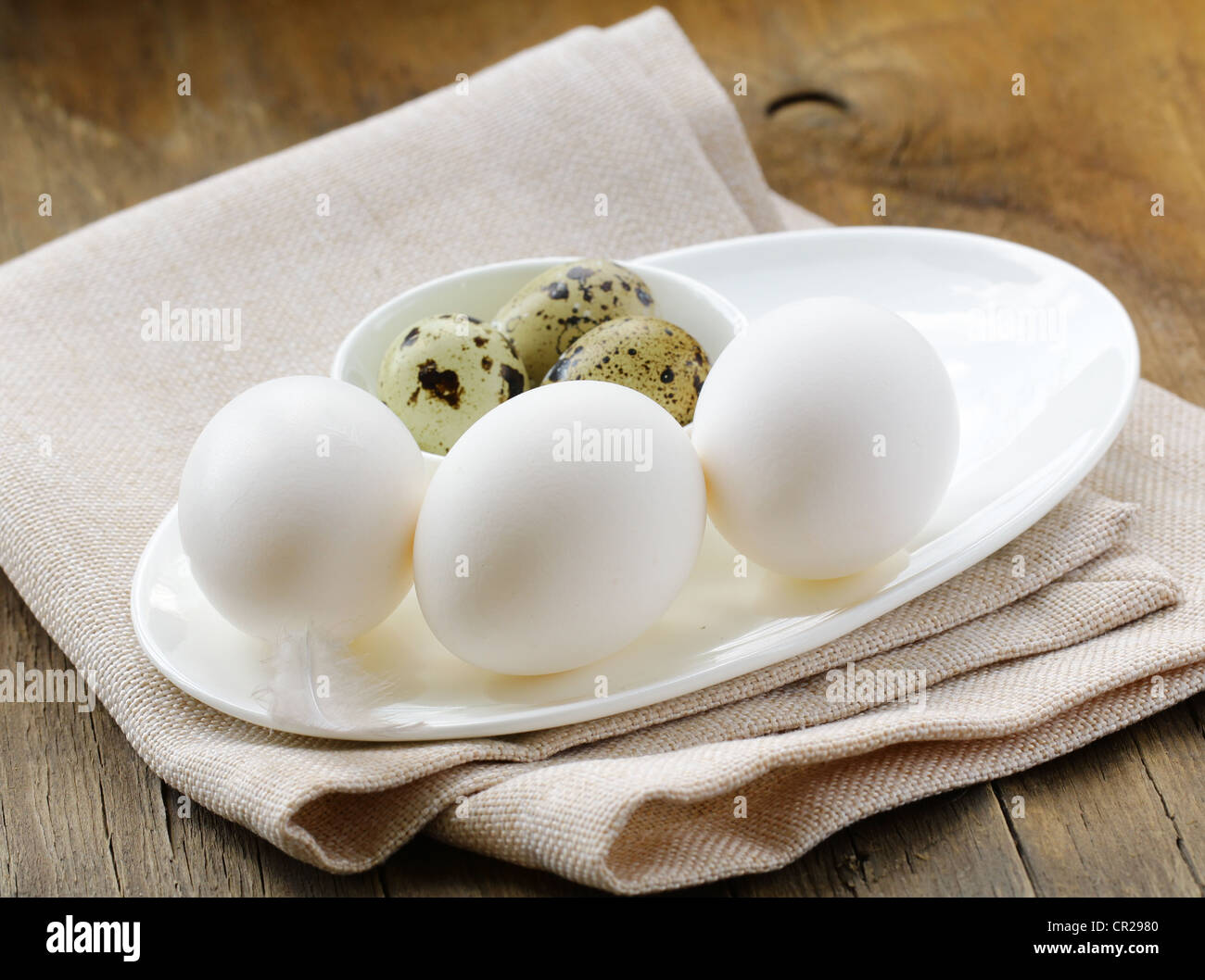 chicken and quail eggs , rustic style Stock Photo - Alamy