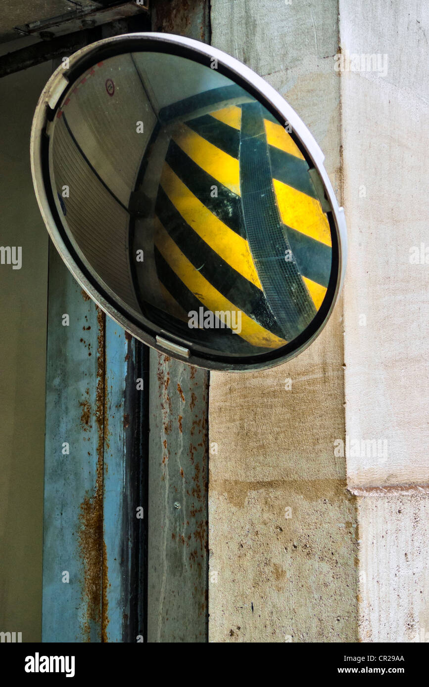 Reflection in car park mirror, Paris Stock Photo - Alamy