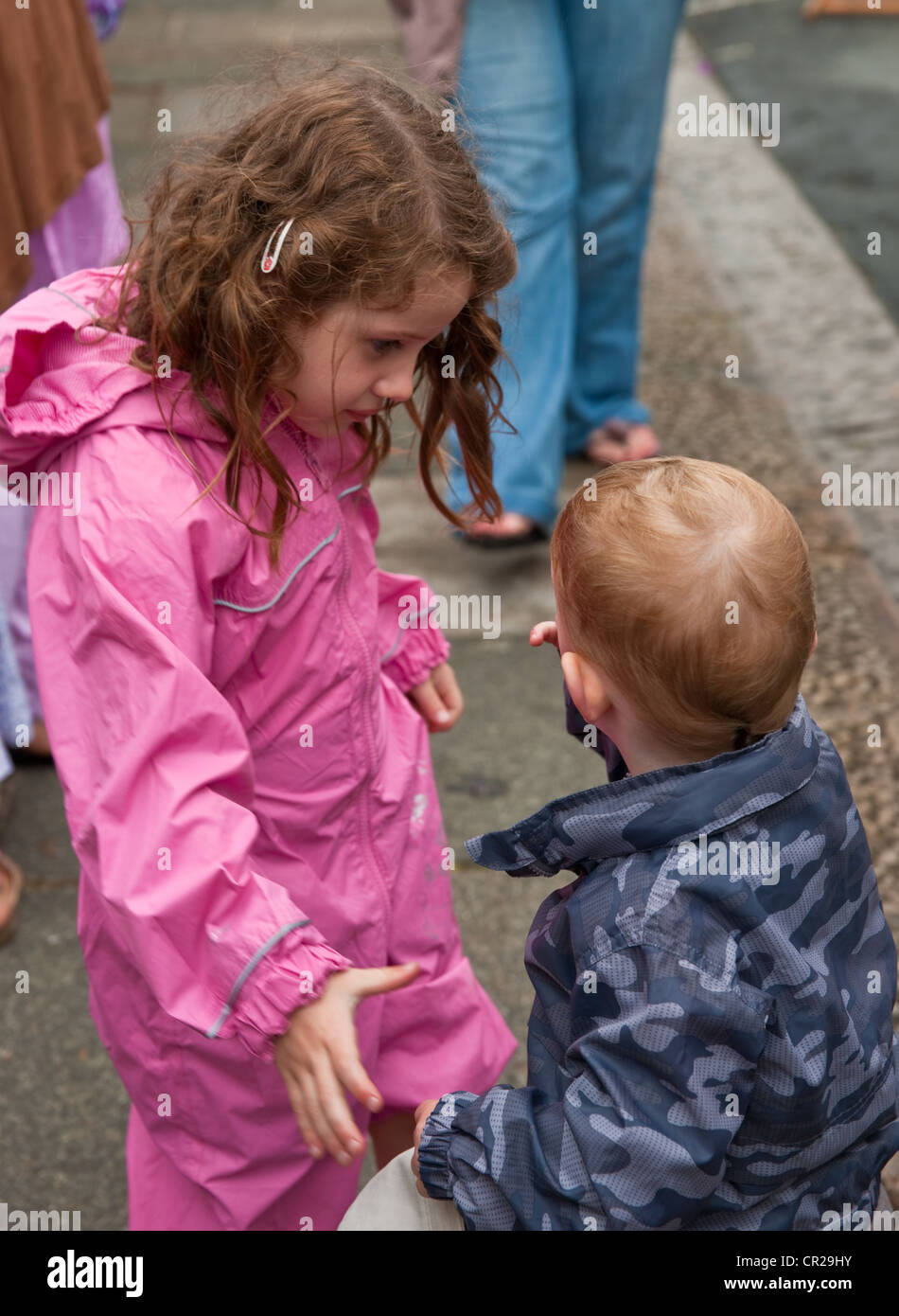 Two small children - a girl and a boy Stock Photo - Alamy