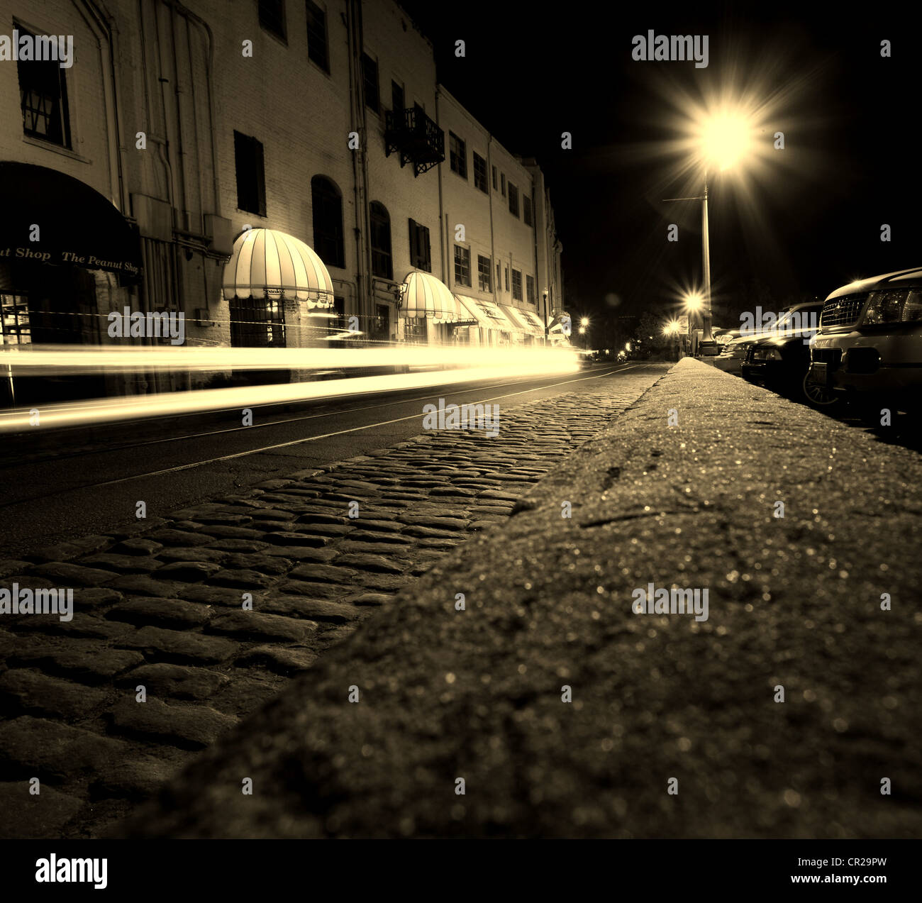street level shot of a passing car a night Stock Photo - Alamy