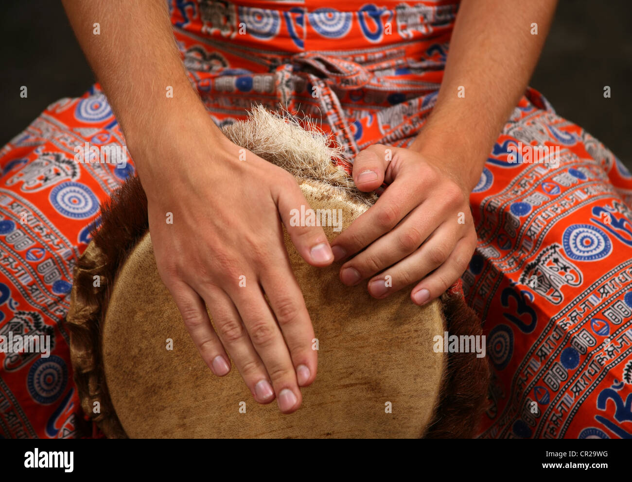 Man playing the djembe (nigerian drum) in studio Stock Photo - Alamy
