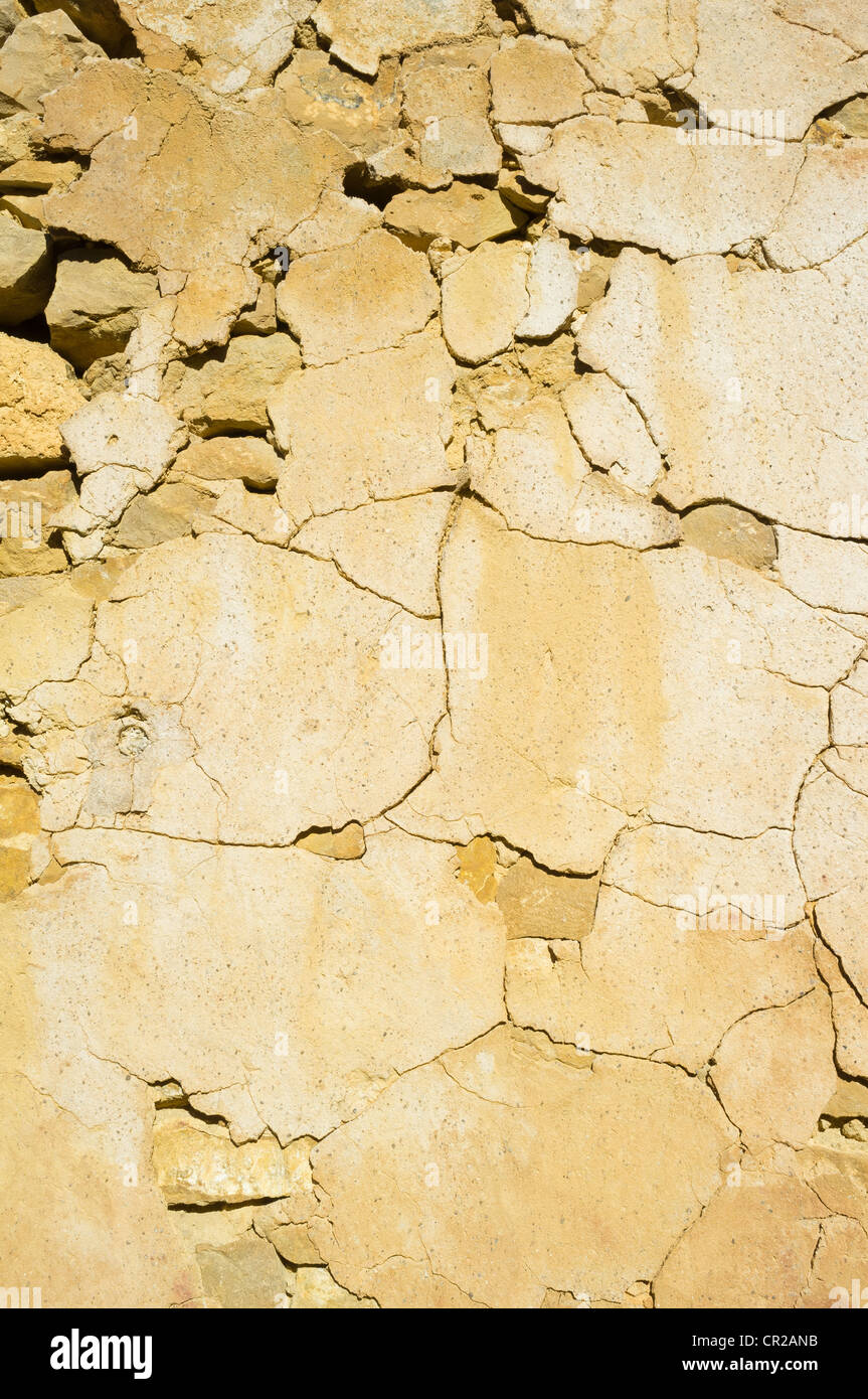 Cracked wall, clay fighting to stay on Stock Photo - Alamy