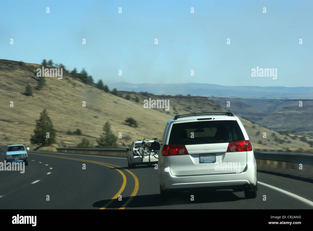 Mountain road, light traffic, blurs, high desert, Central Oregon Stock ...