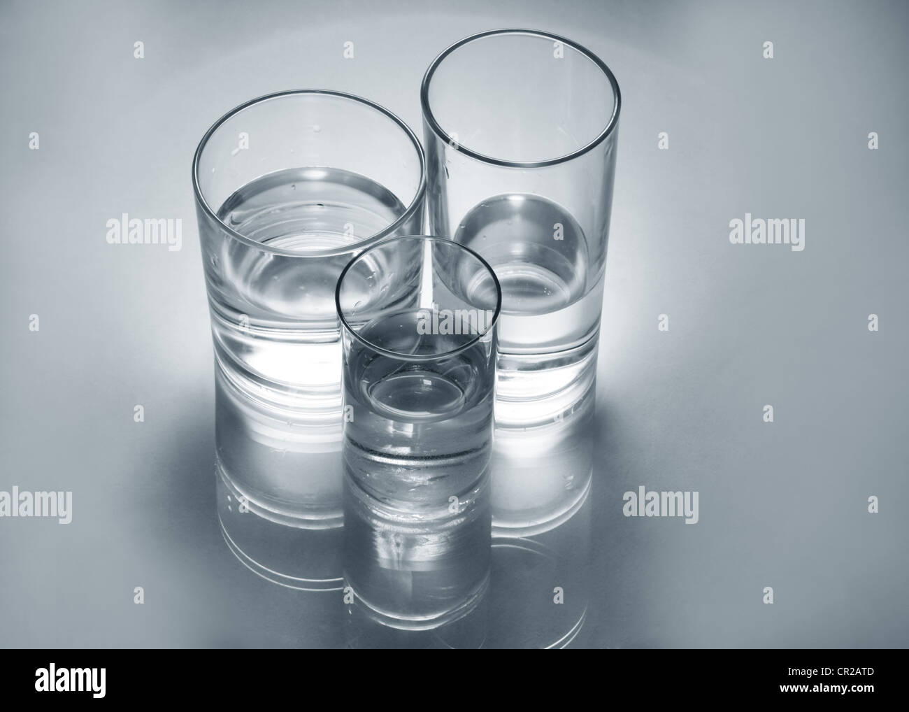 Three different glass glasses with water Stock Photo - Alamy