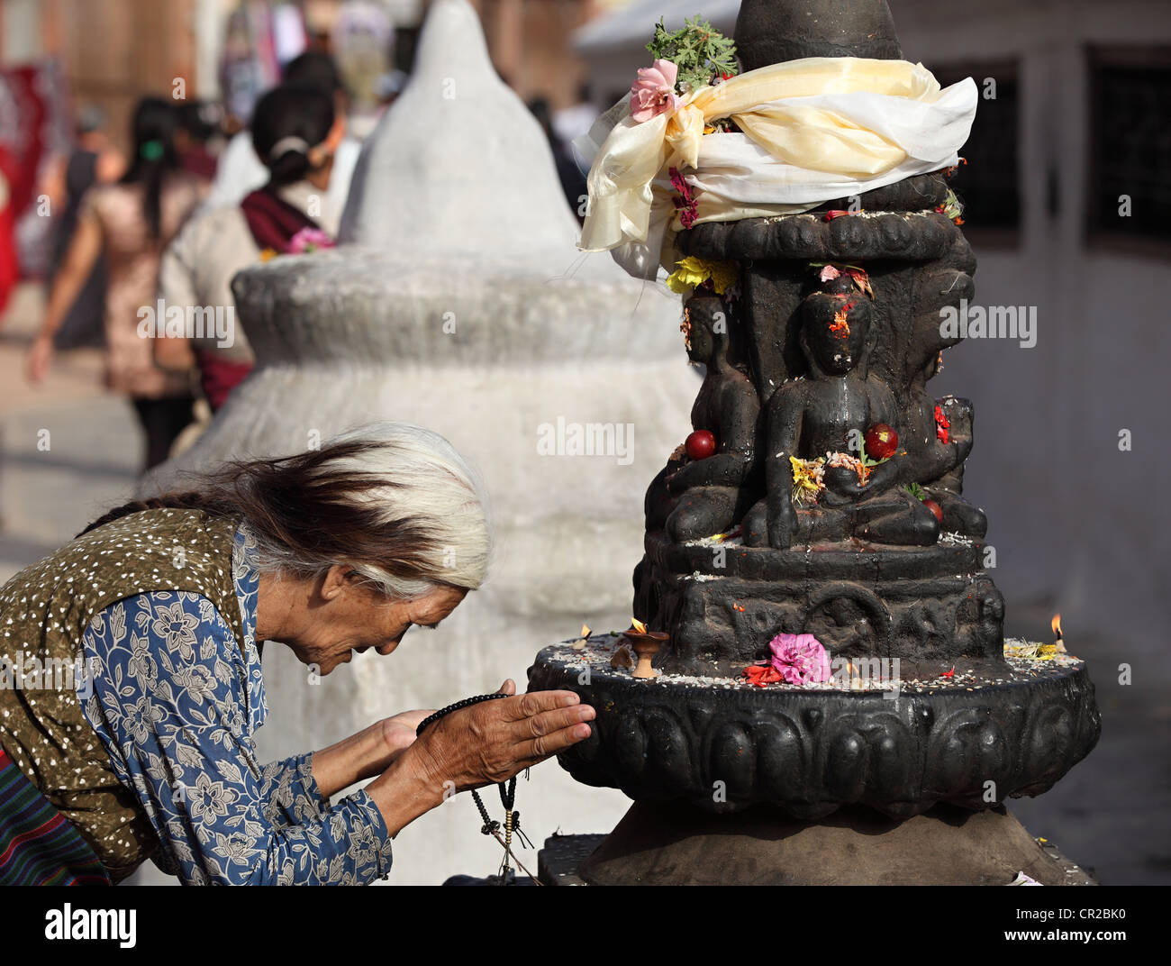 Buddhist Tibetan woman prostrating Nepal Stock Photo - Alamy
