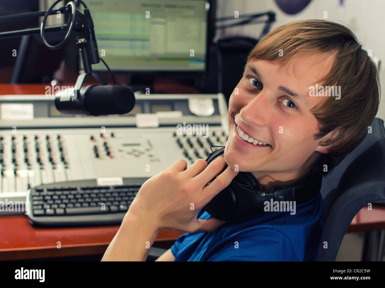 Dj in front of a microphone on the radio Stock Photo - Alamy