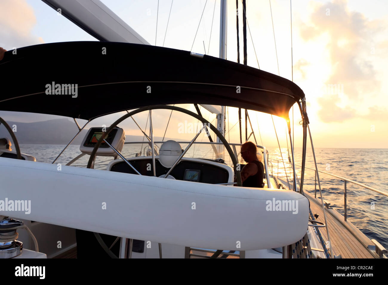 Sailing towards the sunset Stock Photo - Alamy