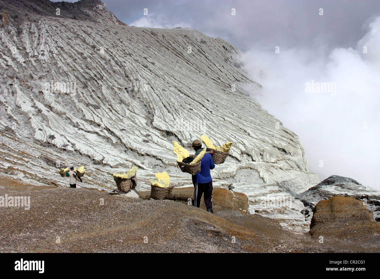 Sulphur Miners on the Crater Rim of Ijen Volcano in Indonesia Stock ...