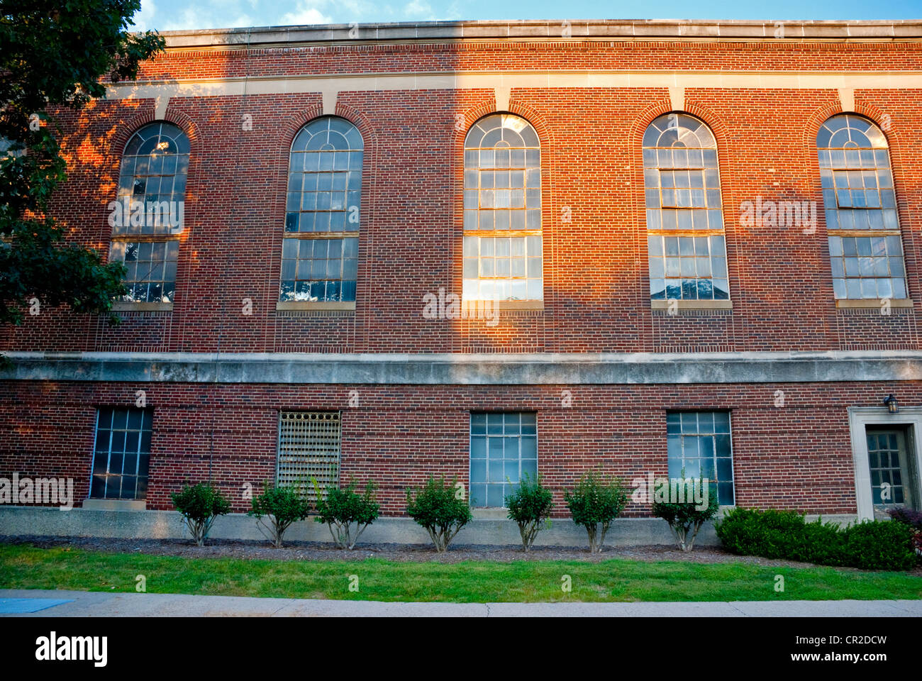 Brick building with fancy windows Stock Photo - Alamy