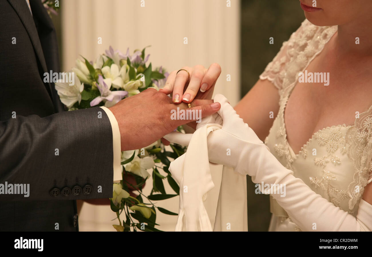 Hands of the groom and the bride during wedding ceremony Stock Photo ...