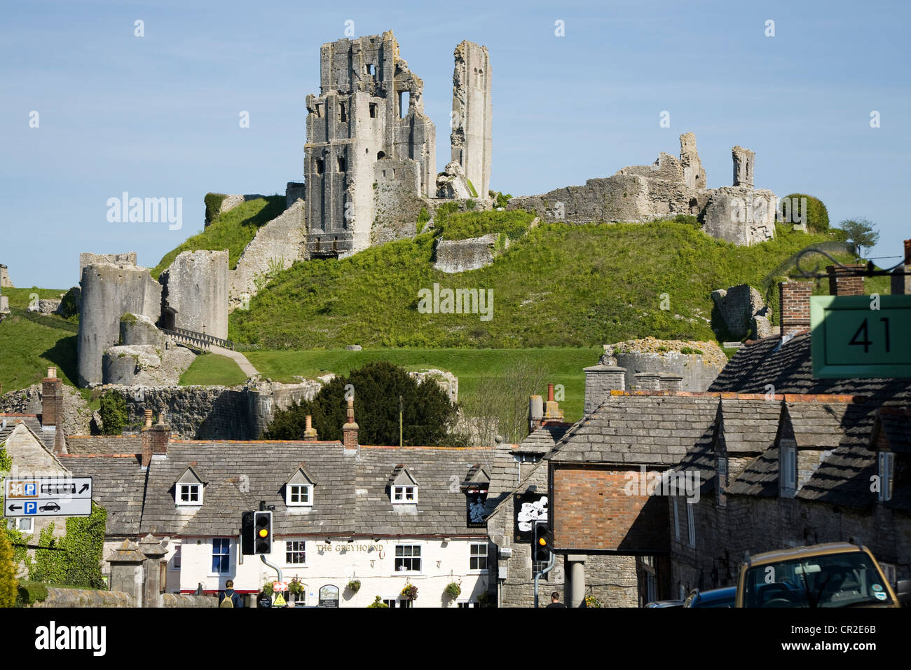 Corfe Castle with the buildings and houses of Corfe town in the ...