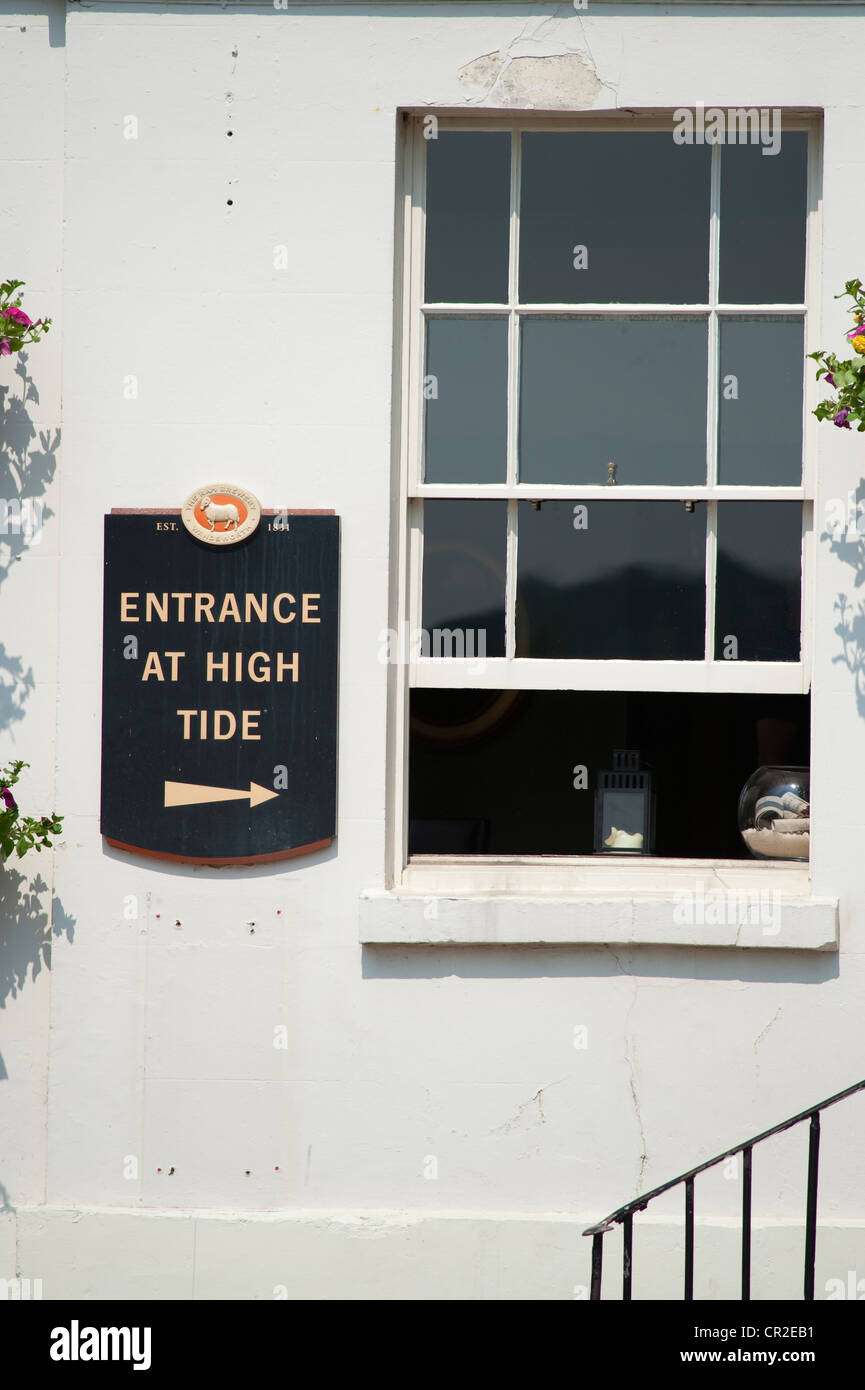 Entrance at high tide sign on the White Cross pub, banks of the river ...