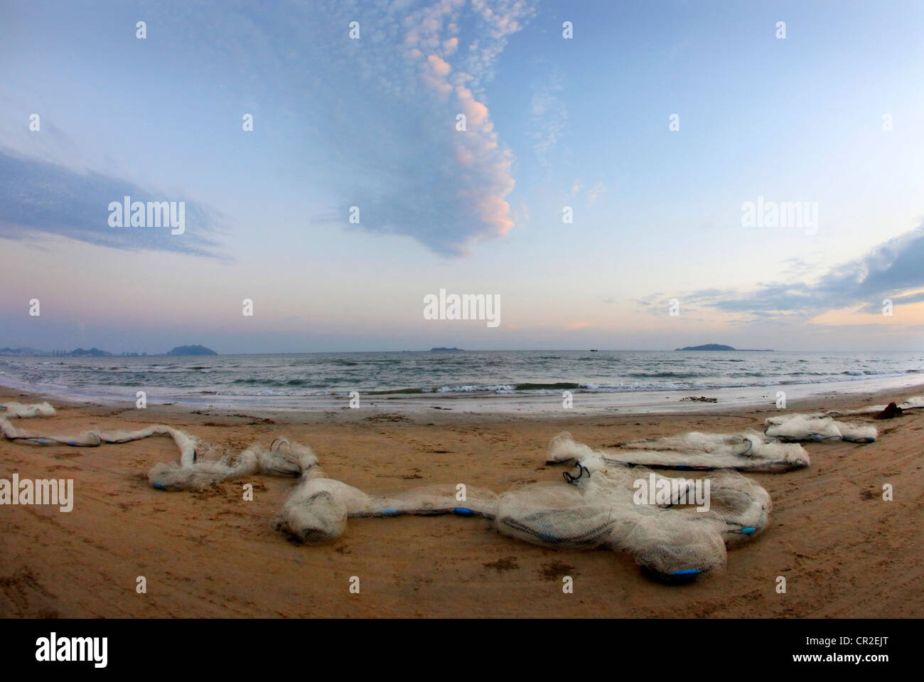Panorama of a beach with fishing networks on a coast Stock Photo - Alamy