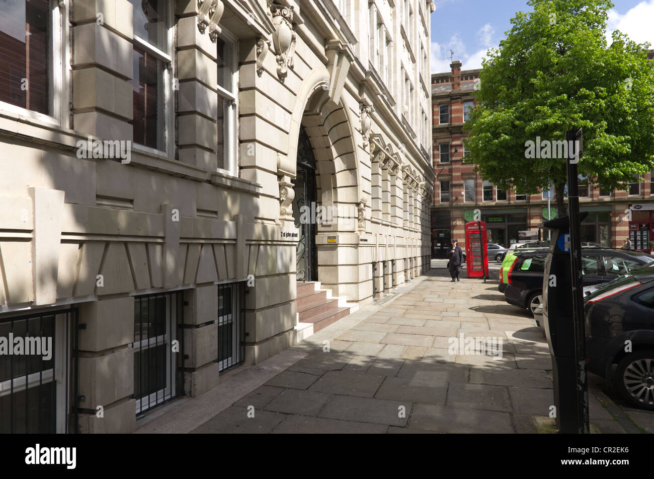 A view of St. John Street Manchester showing a building with white ...