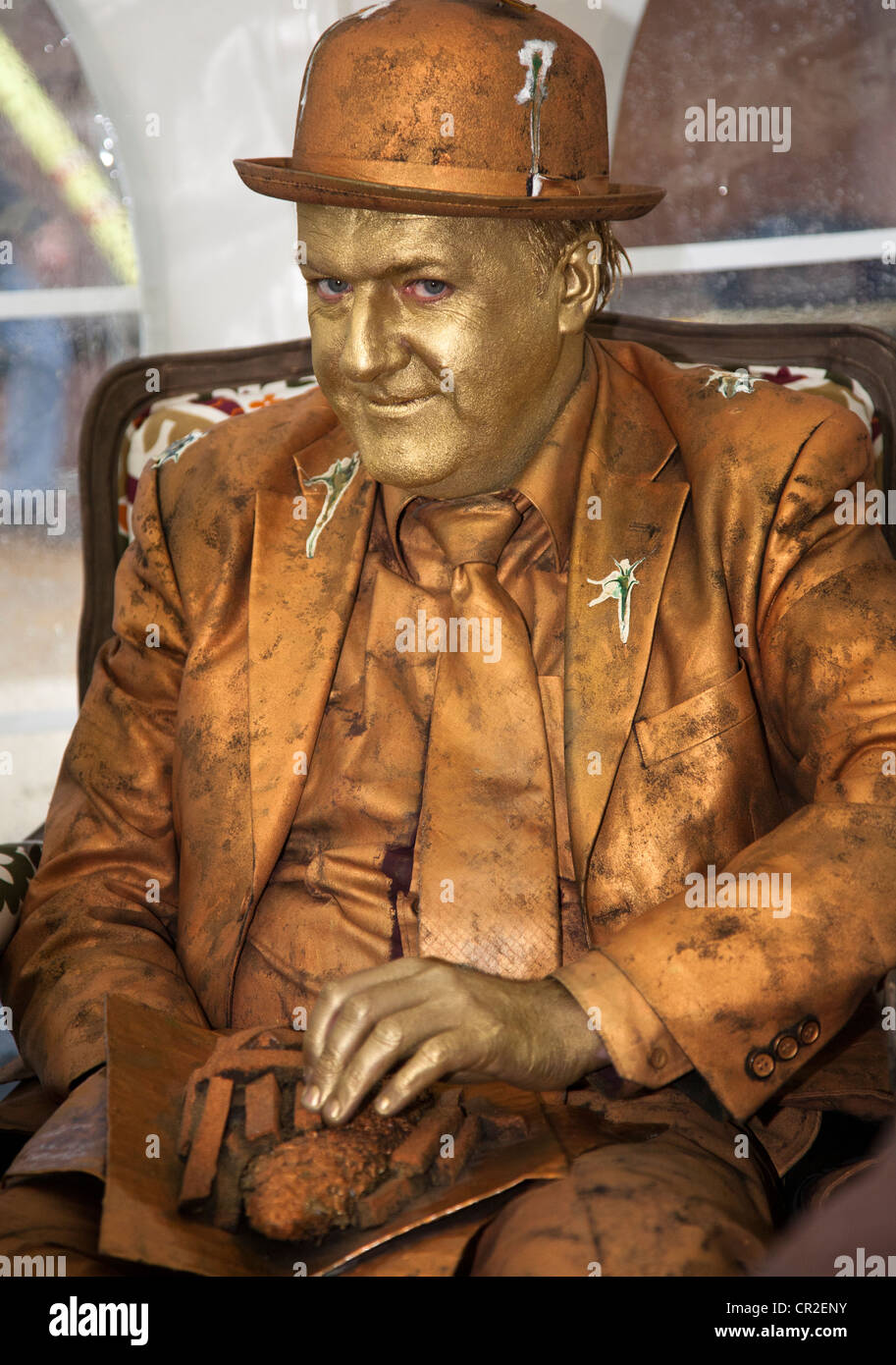 The Gold Man living human street Statue. Comical Andy Train in golden ...