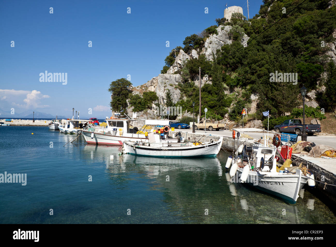 Fishing boats moored in the harbour at Frikes on the island of Ithaca ...