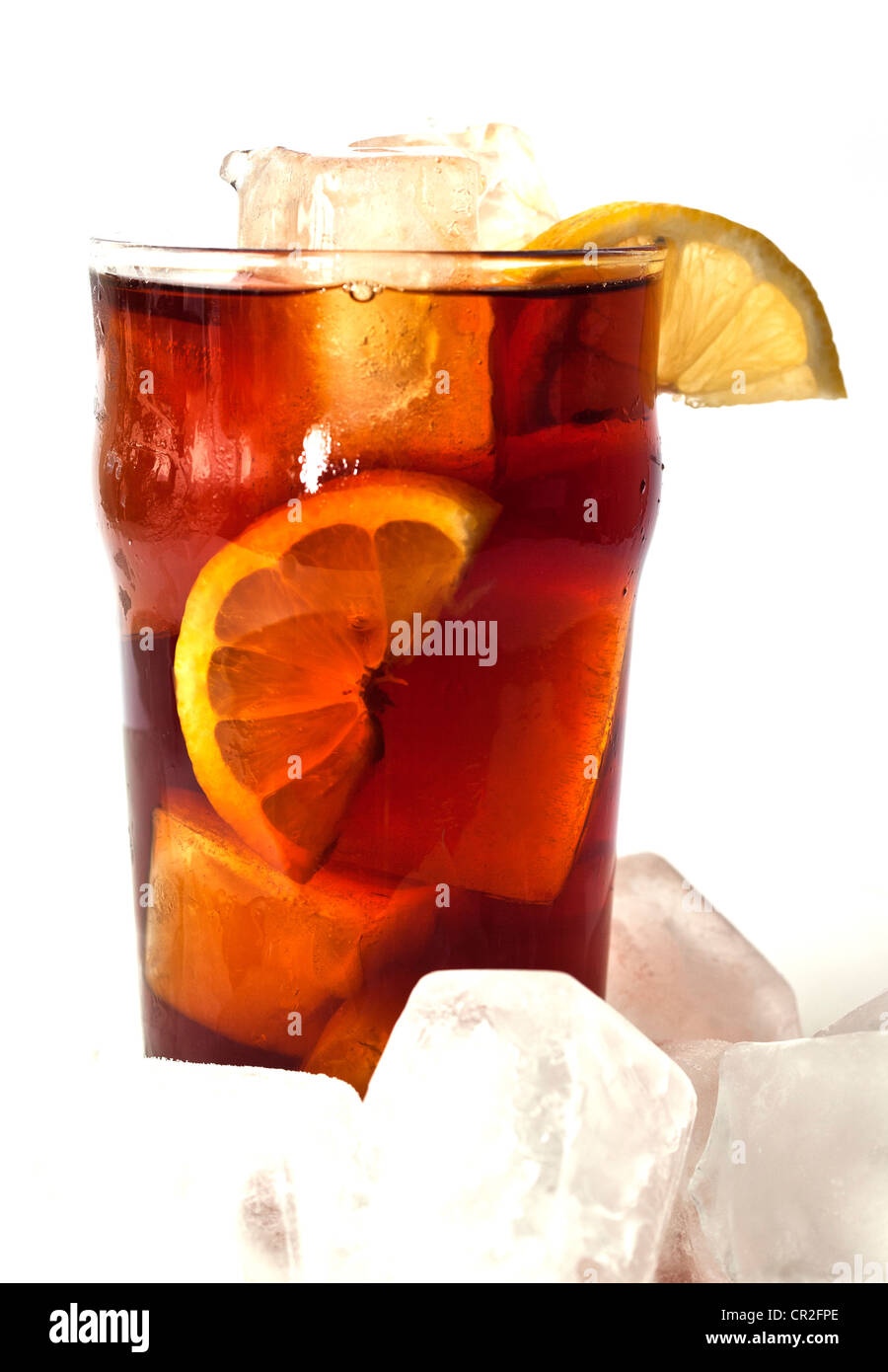 cold iced tea in glass on ice on white background Stock Photo - Alamy