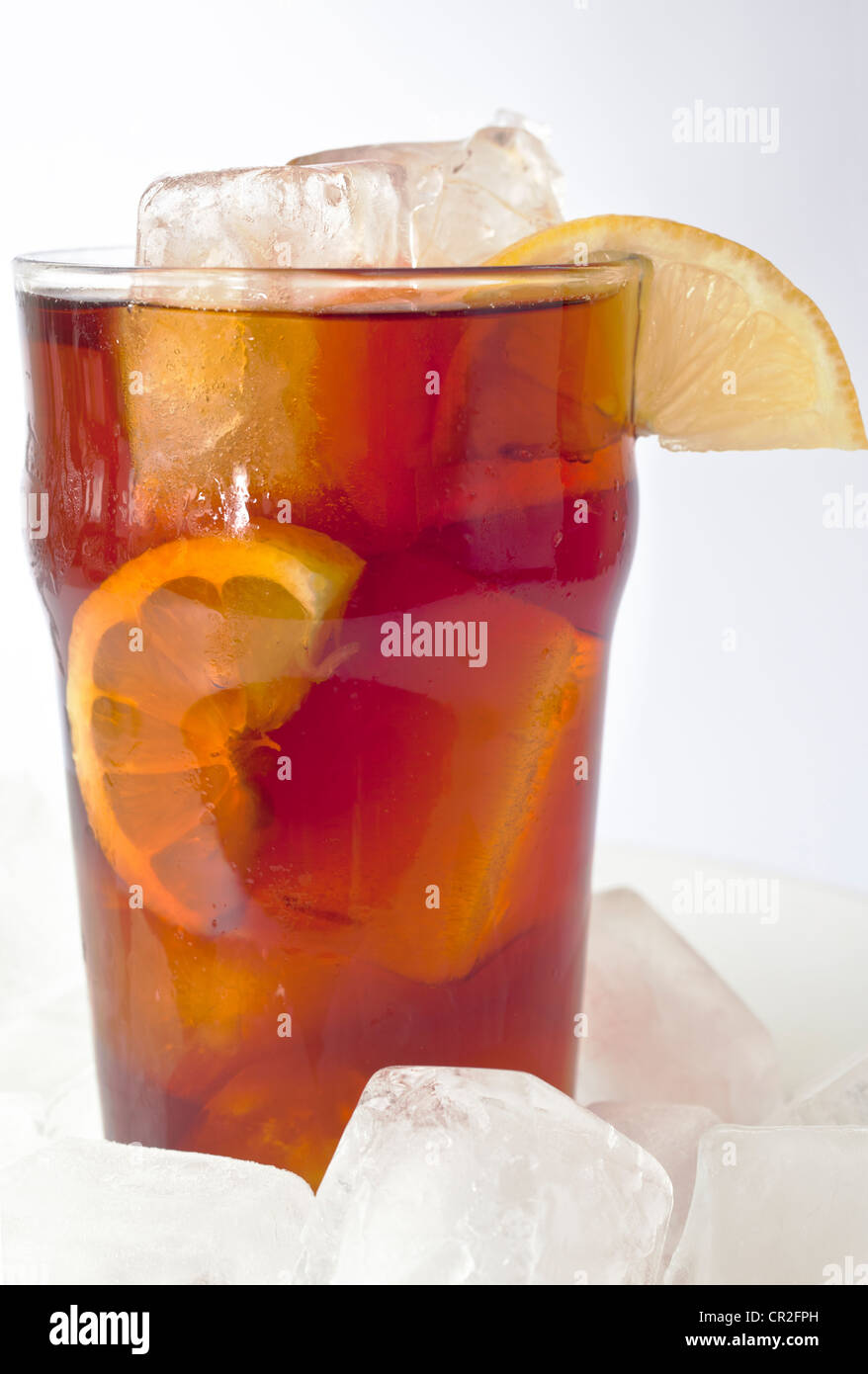 cold iced tea in glass on ice on white background Stock Photo - Alamy