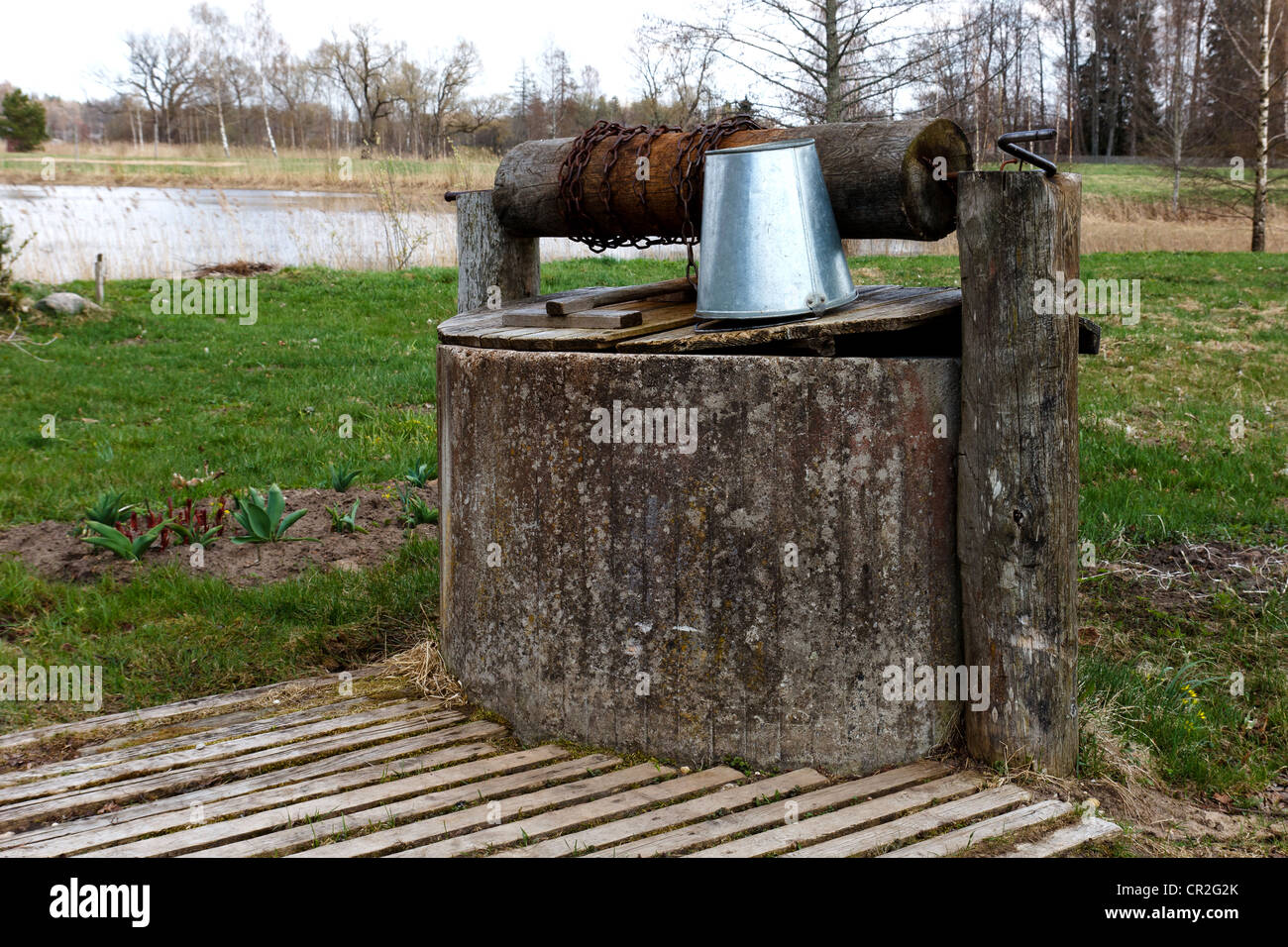 old concrete water well in the countryside Stock Photo - Alamy