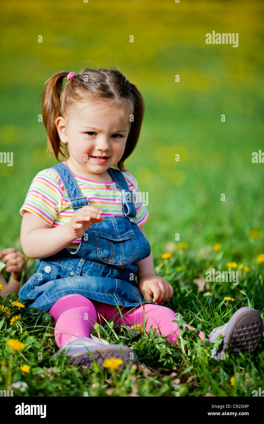 Little girl in the field Stock Photo - Alamy