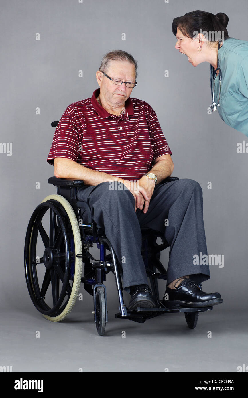 Elder abuse concept: senior man with head down in a wheelchair as a ...