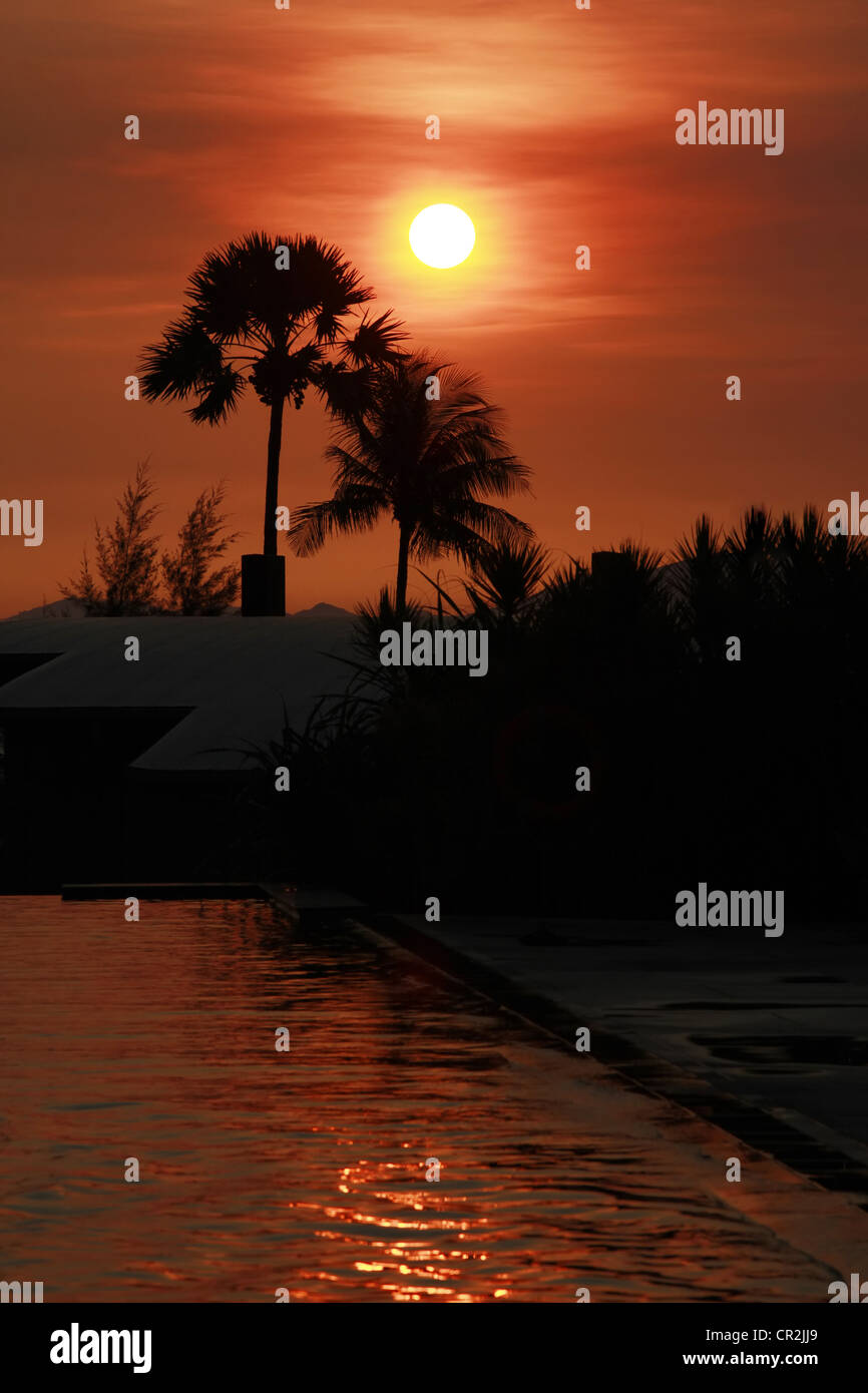 Beautifull tropical sunset at a swimming pool Stock Photo - Alamy