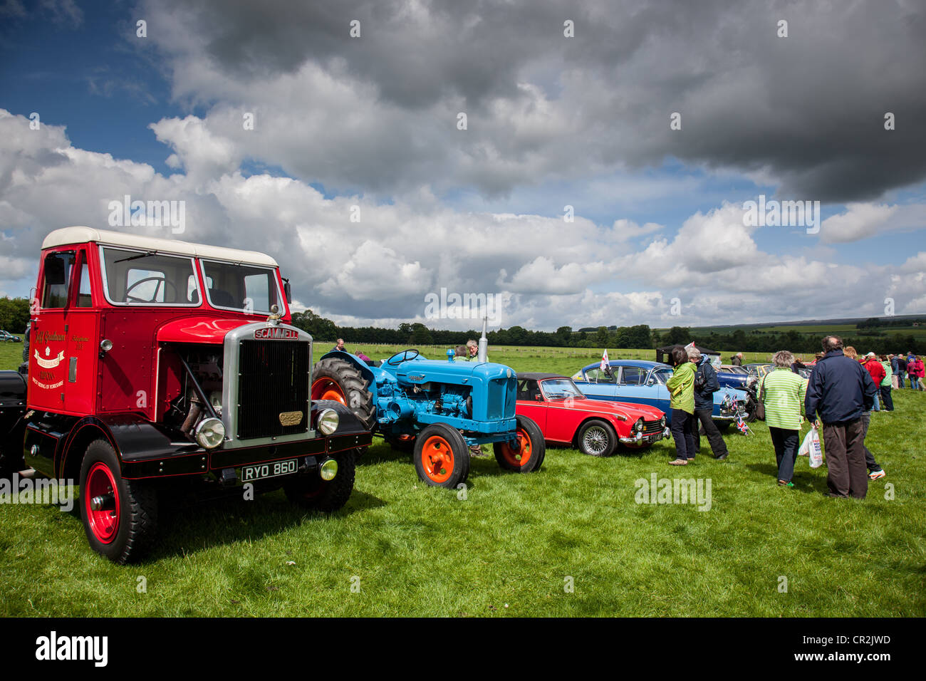 Spectators and tourists looking at vintage vehicles at the Duncombe ...