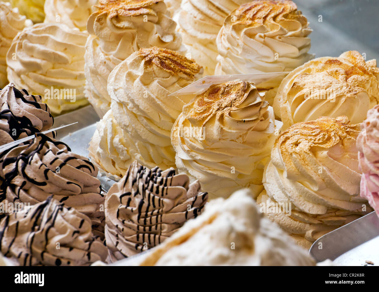 Meringues in s shop window Stock Photo - Alamy