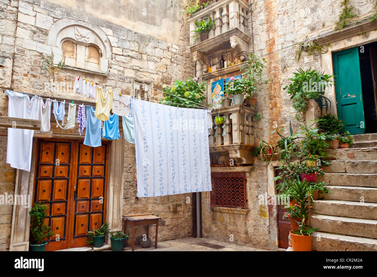 Colorful courtyard in Trogir, Croatia. UNESCO town Stock Photo - Alamy