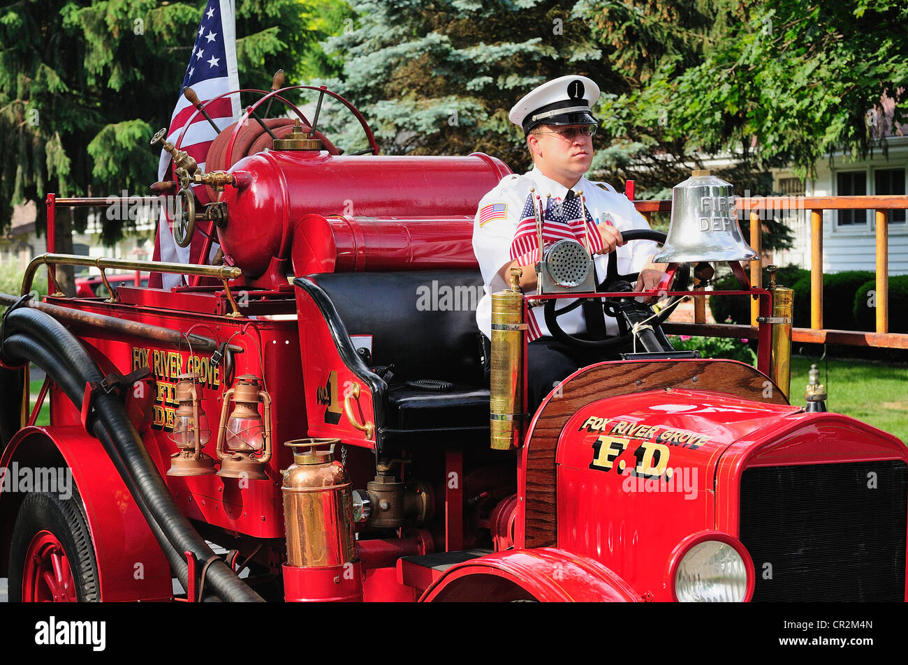 A vintage 1923 fire engine from small town America riding in the ...