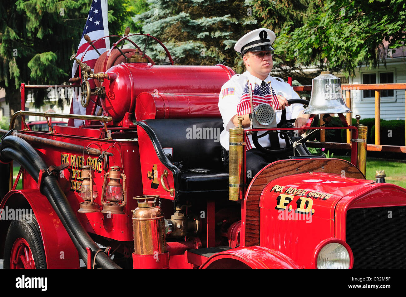 A vintage 1923 fire engine from small town America riding in the ...