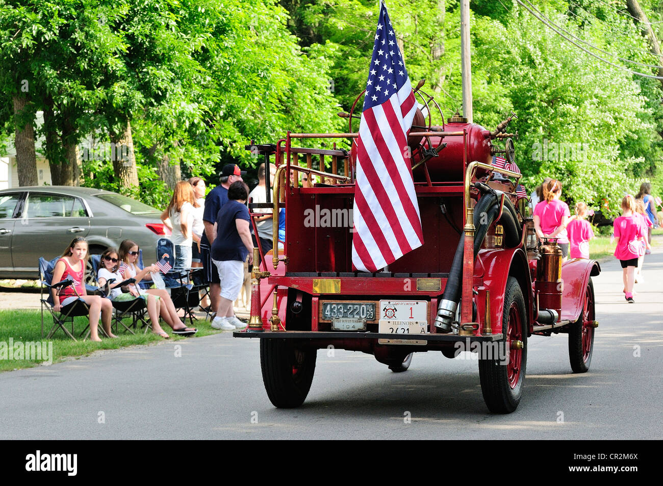 A vintage 1923 fire engine from small town America riding in the ...