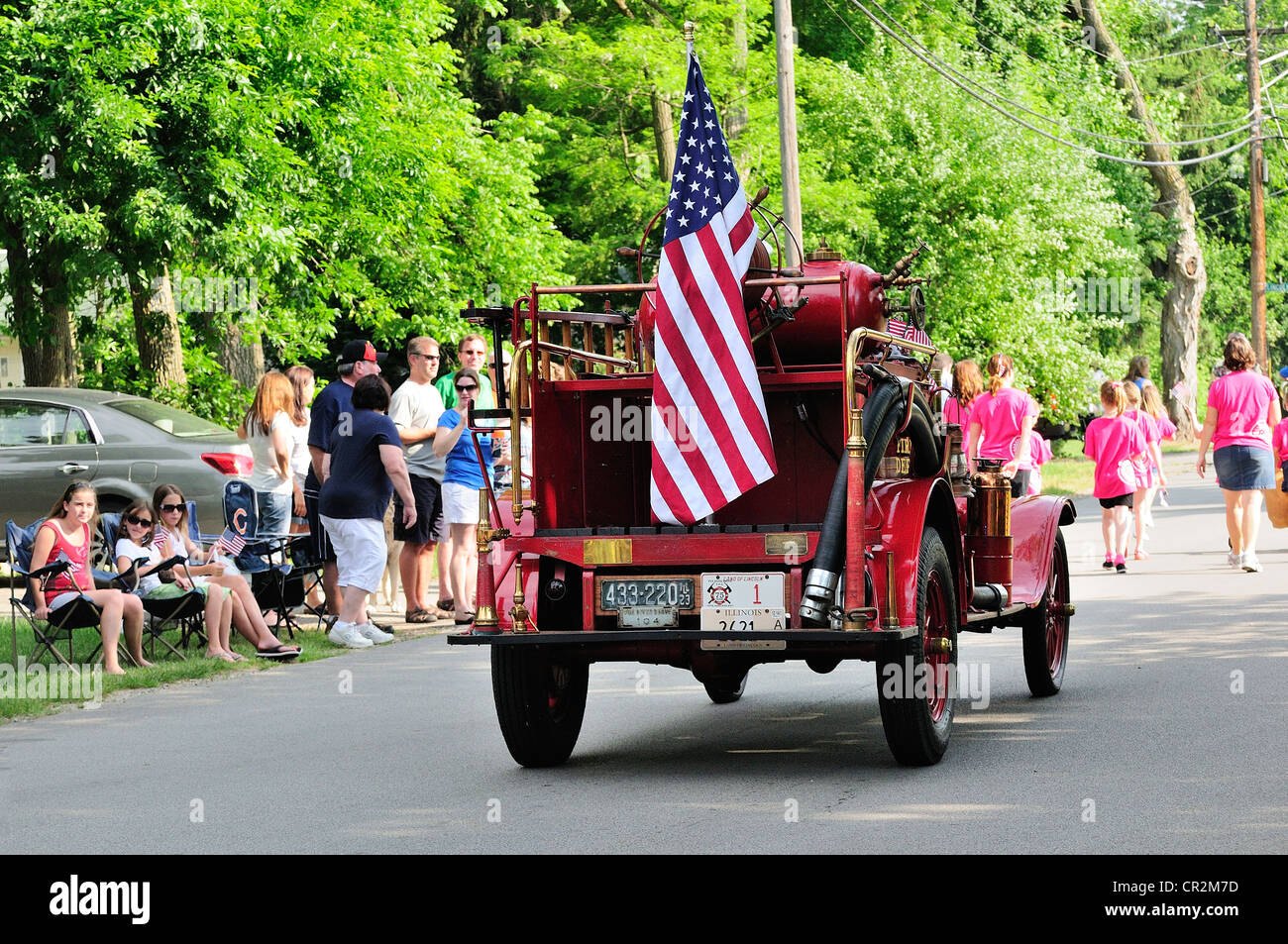 A vintage 1923 fire engine from small town America riding in the ...