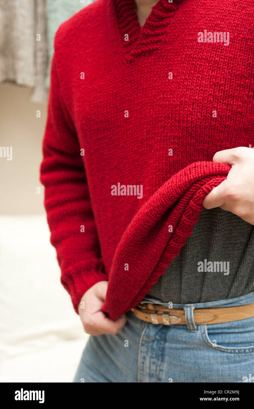 Putting on a jumper hi-res stock photography and images - Alamy