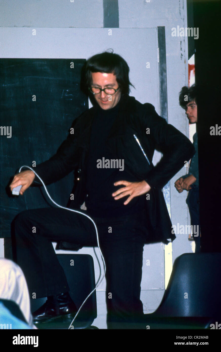 Young Sir Peter Cook of Archigram Architects giving a lecture at the ...