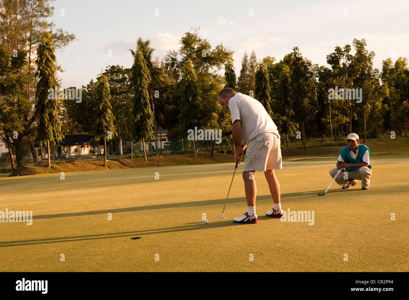 Man playing golf at Mactan Coral Golf Club. Lapu-Lapu City, Metro Cebu ...