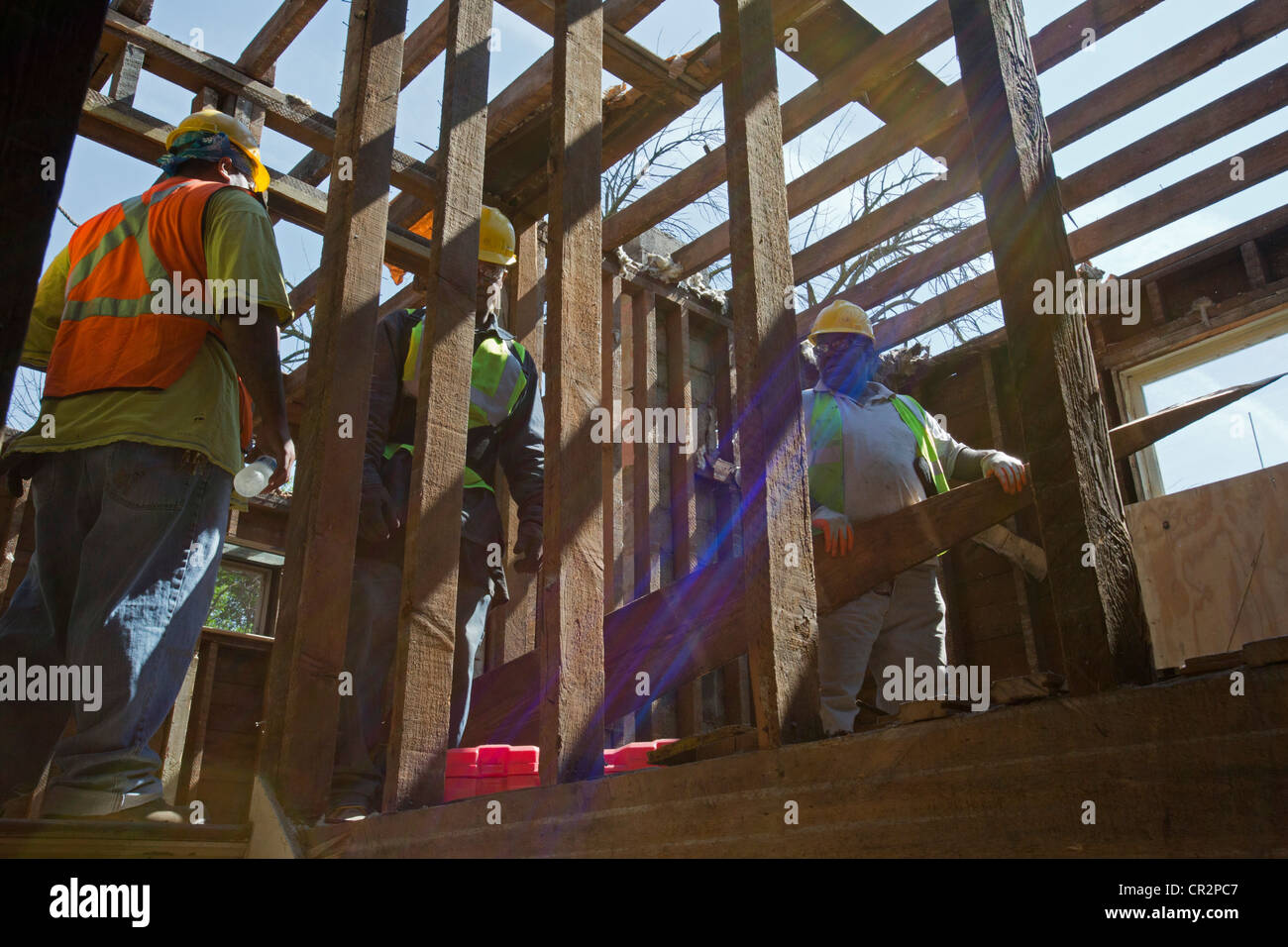 Workers Salvage Building Materials from House Being "Deconstructed ...