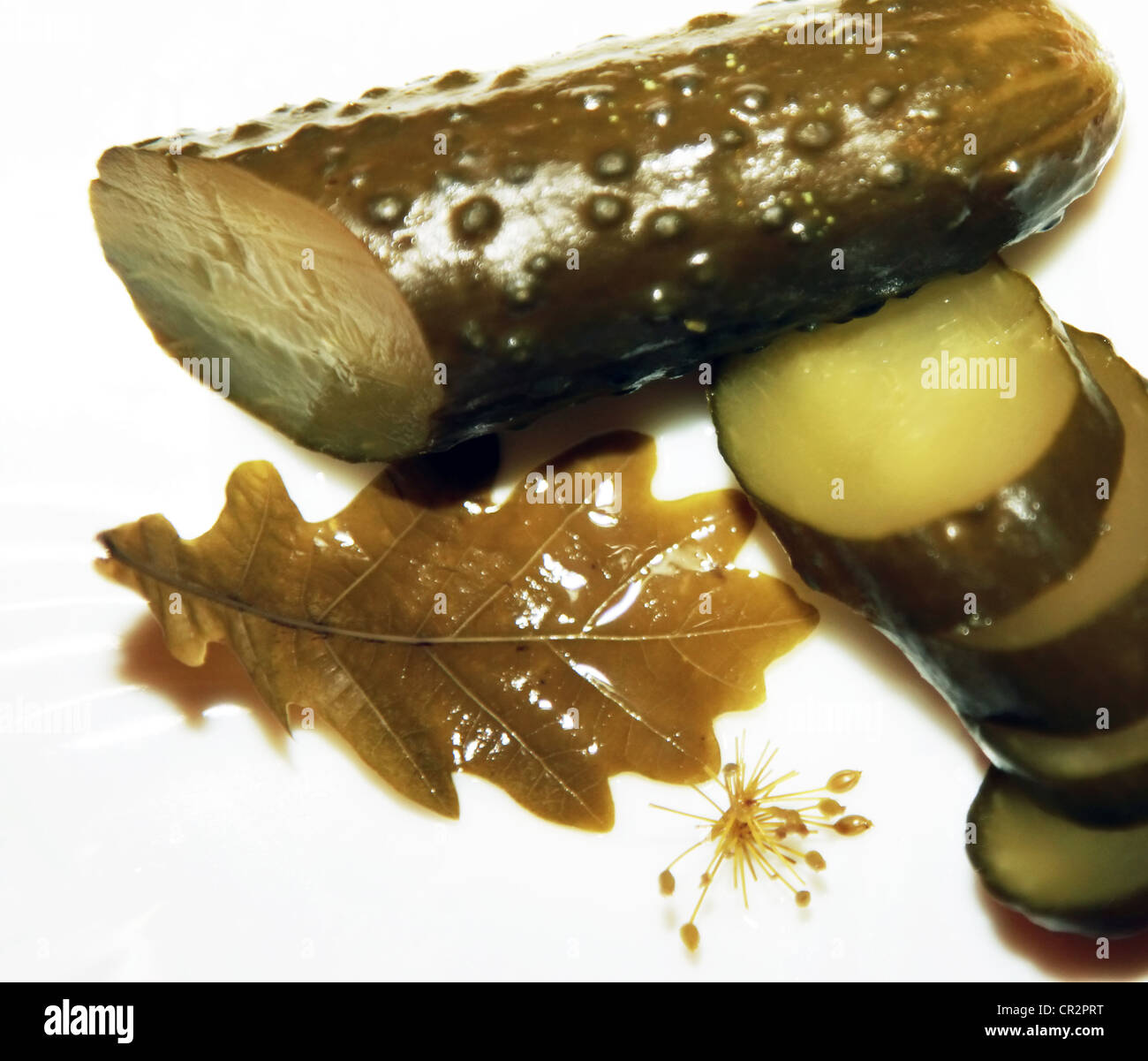 The salted cucumber on a white plate Stock Photo - Alamy