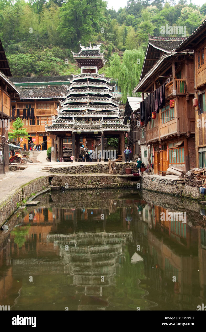 An ancient Drum Tower near an expanse of water, Zhaoxing Dong Village ...