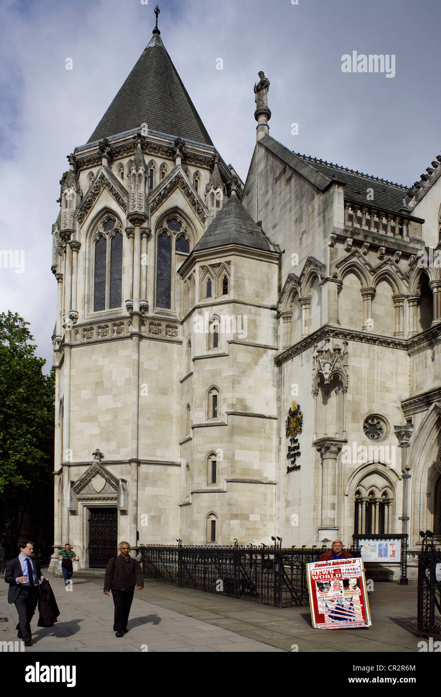 Former News of the World photographer Ian Cutler demonstrates during ...