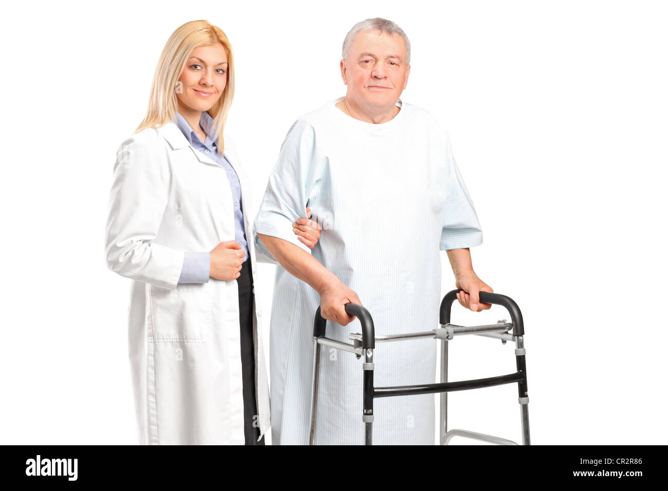A female doctor or nurse helping a senior patient to use a walker ...