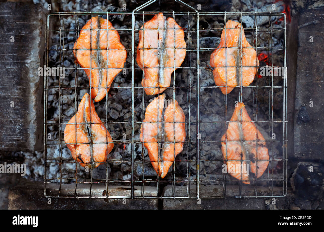 Fried sea fish. Preparation on open fire Stock Photo - Alamy